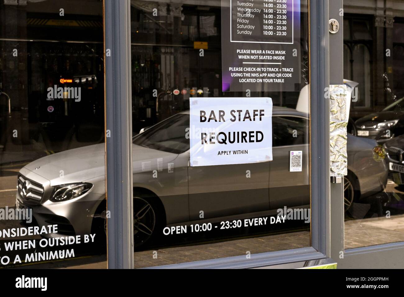 London, England - August 2021: Sign on the front window of a bar ...