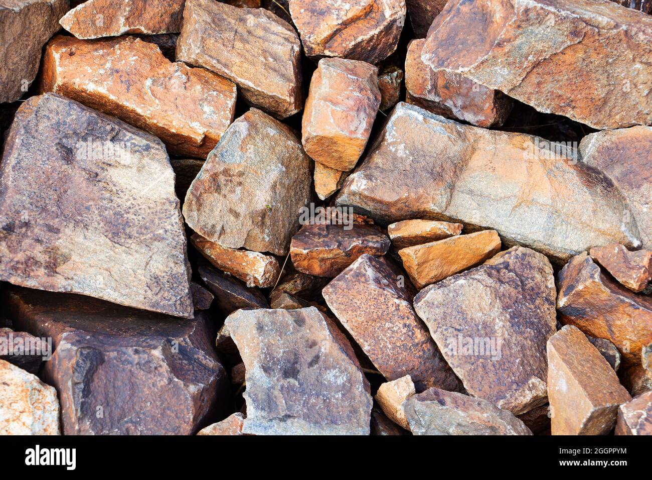 Rockfall on the road in the mountains. Stones of different sizes ...