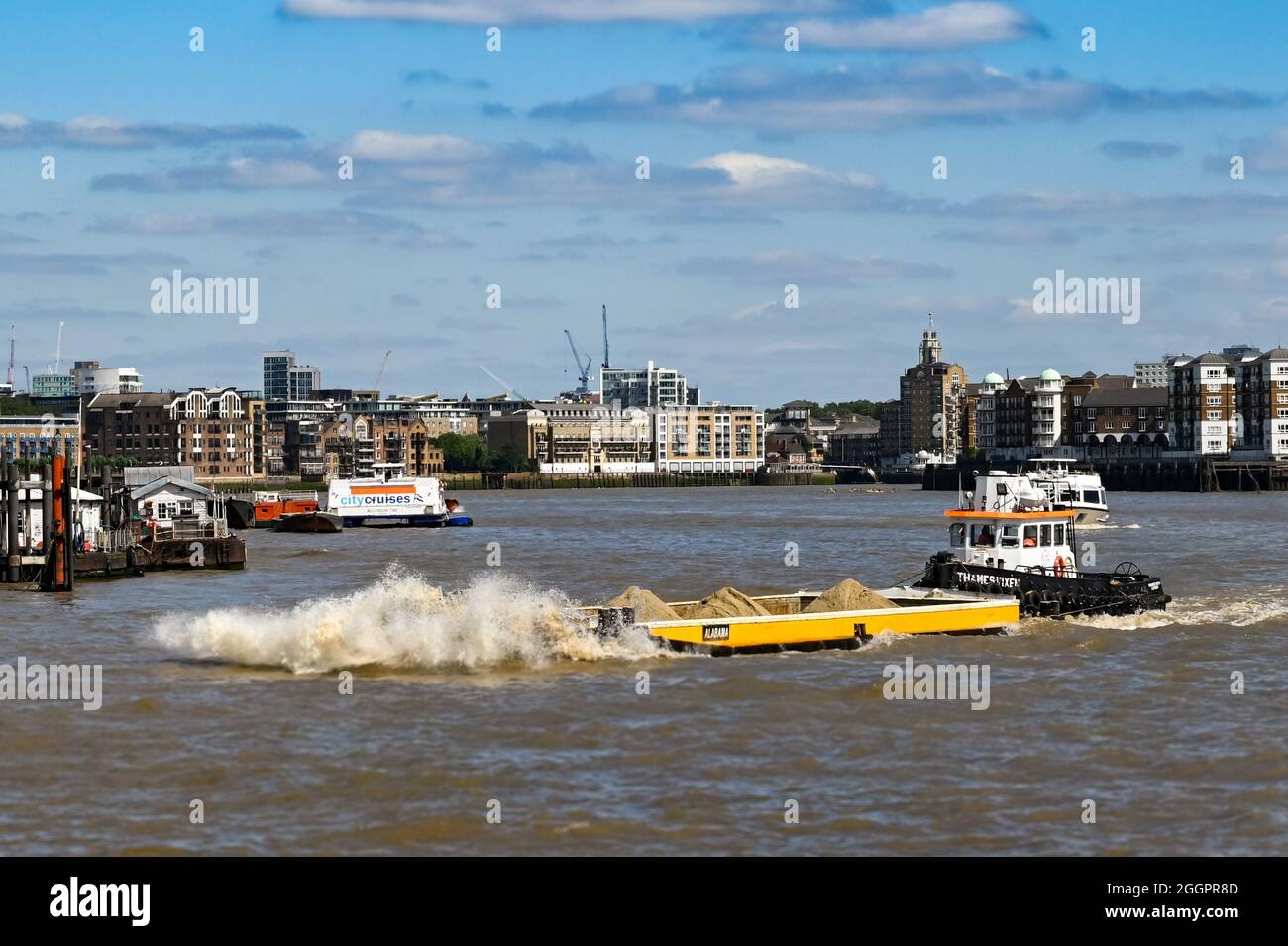 London, England - August 2021: Industrial barge pushing an industrial ...