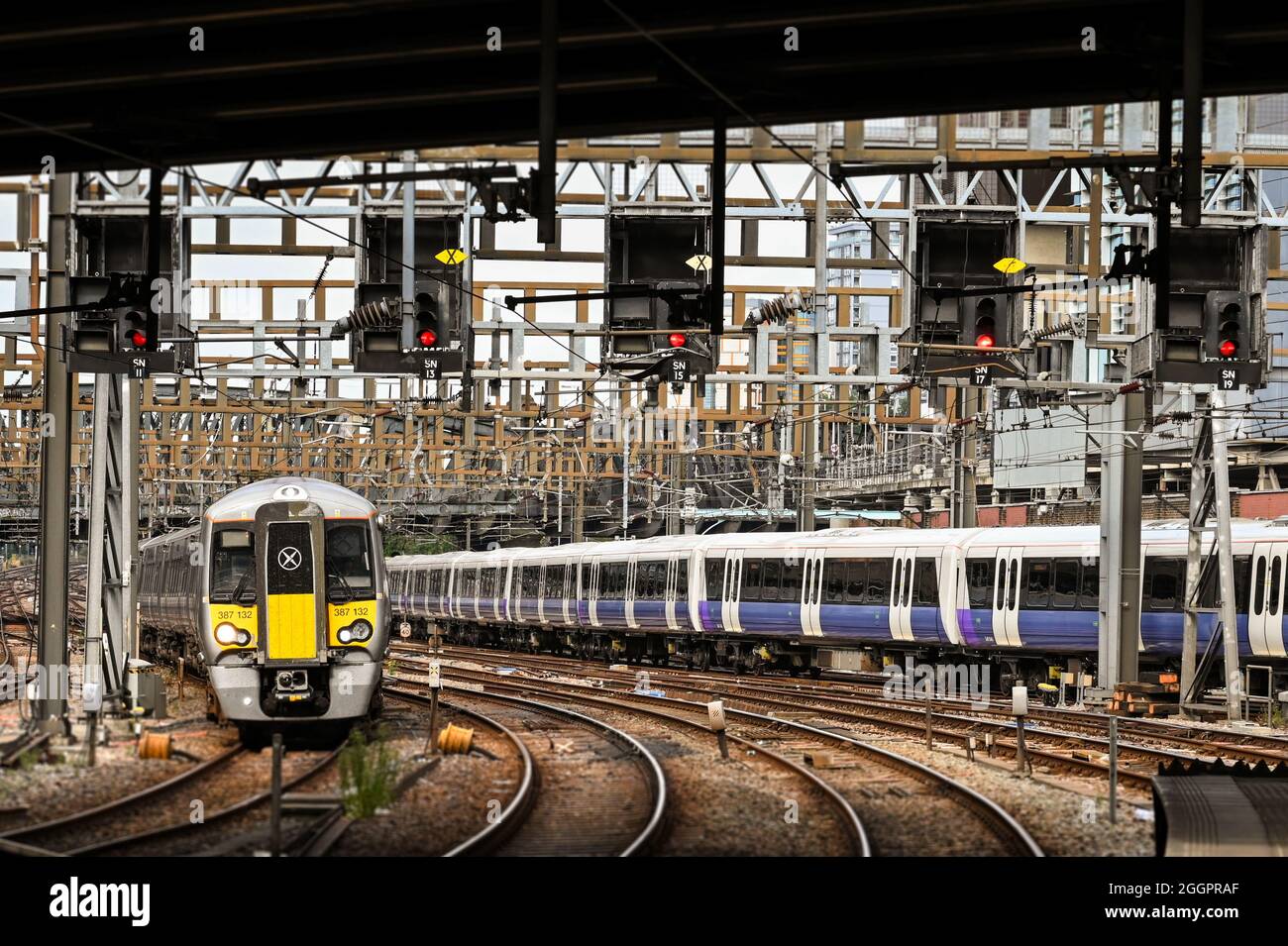 London, England - August 2021: Commuter trains entering and leaving ...
