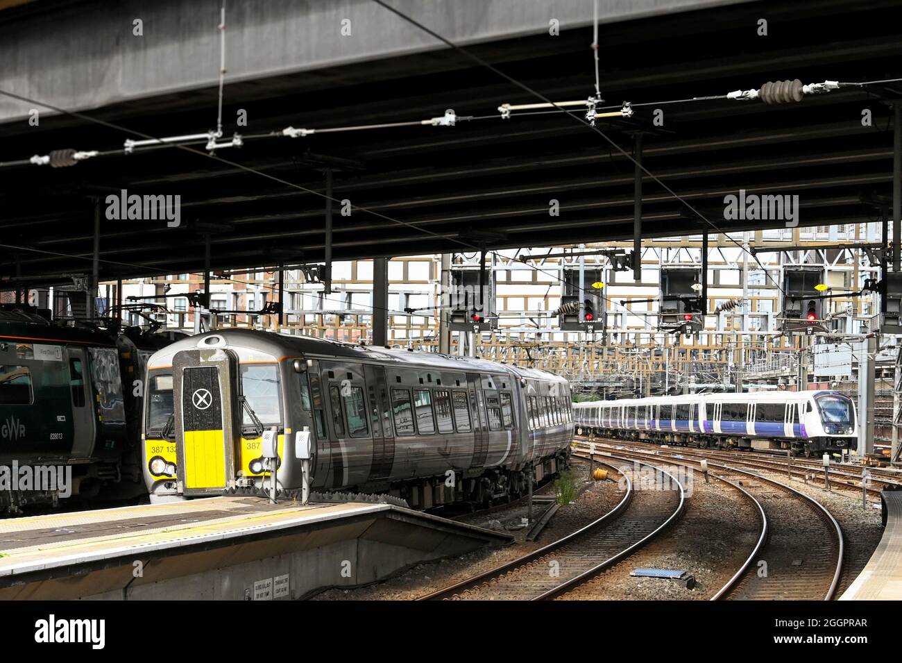 London, England - August 2021: Commuter trains entering and leaving ...