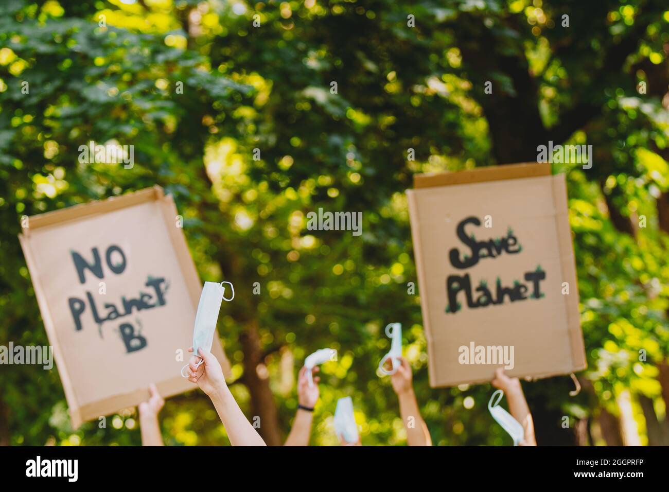 Homemade poster at environmental rally in the green park, people ...