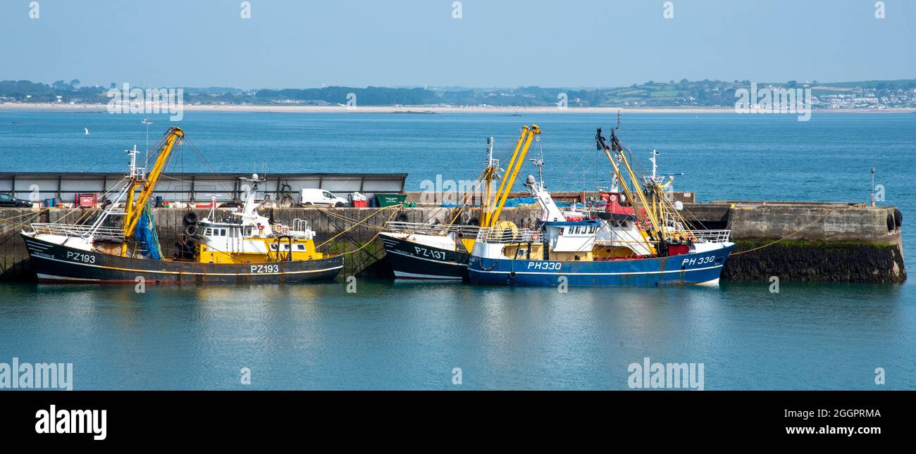Newlyn, Cornwall, England, UK. 2021. Fishing trawlers alongside the ...