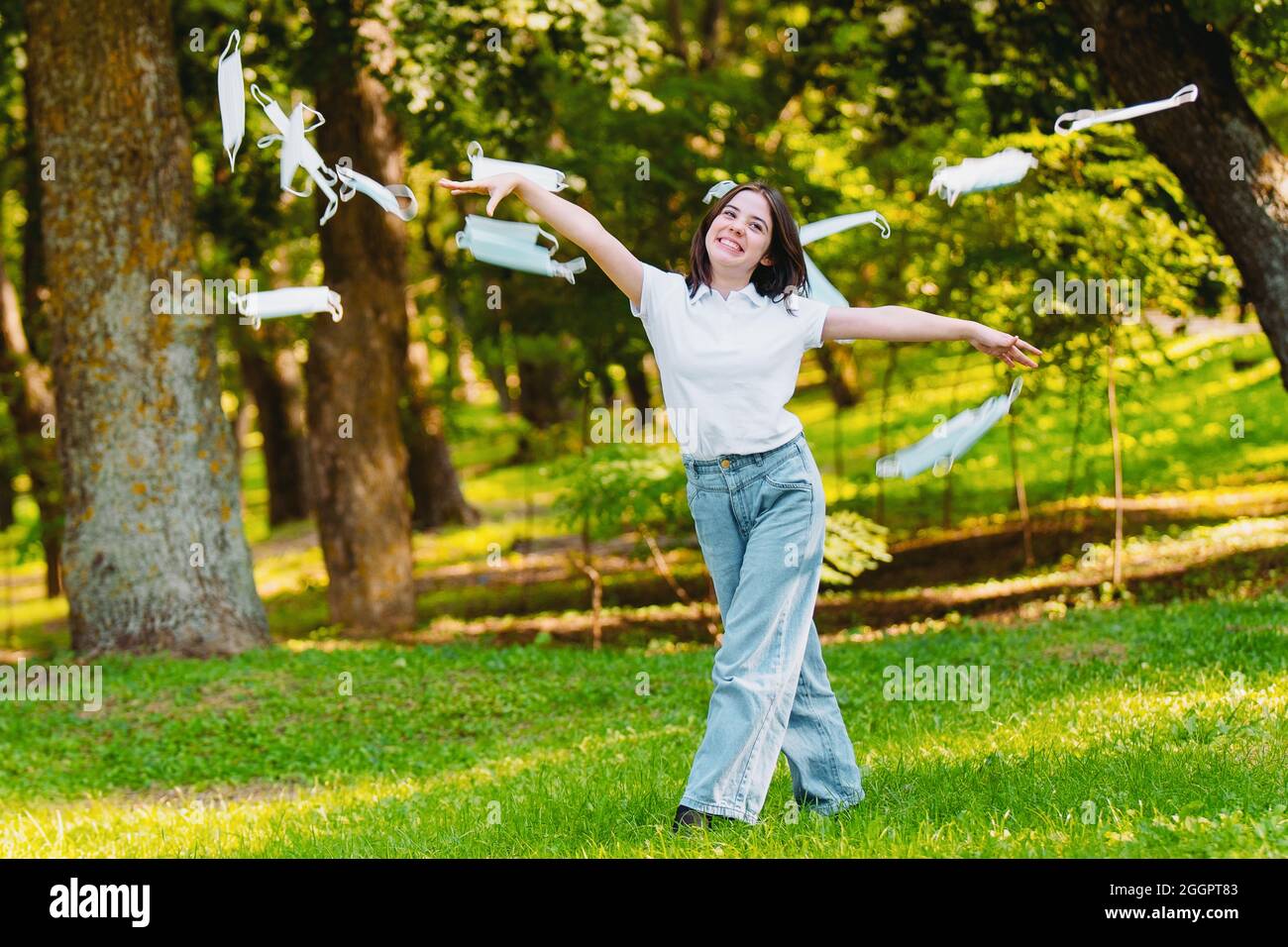 Close up photo of a happy young woman activist being outdoors throwing ...