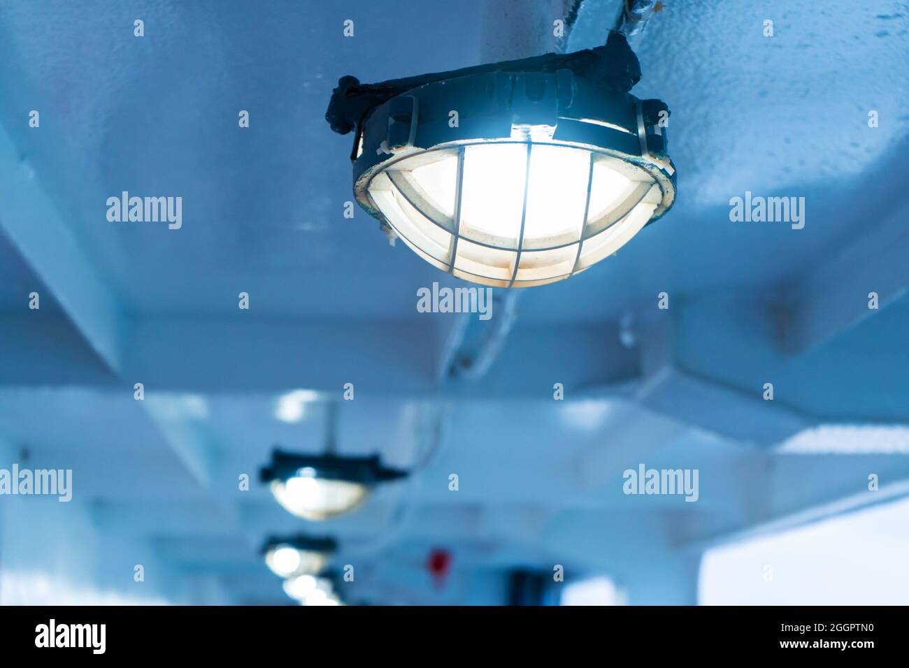 Emergency lighting system. Lamps protected by a grill Stock Photo - Alamy