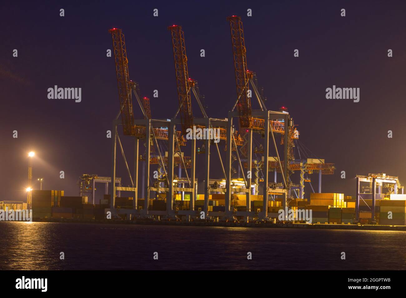 industrial port with containers at night time. Container terminal of ...