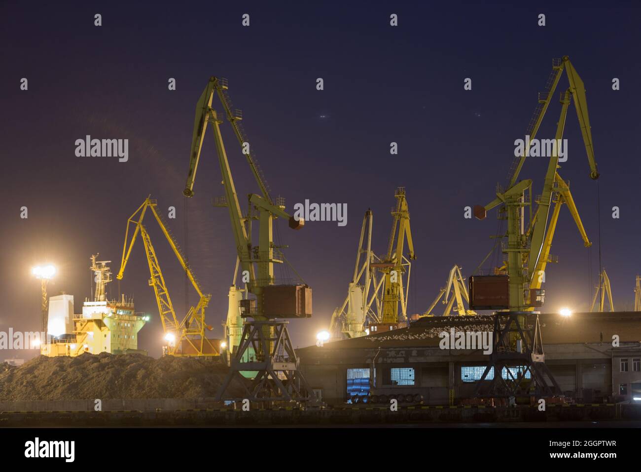 Port terminal of bulk cargo at night time. Industrial port at night ...