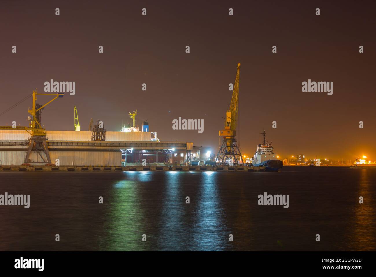 Port terminal of bulk cargo at night time. Industrial port at night ...