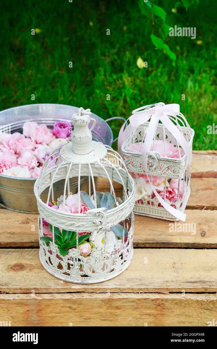 Garden party decorations: Vintage bird cages with flowers inside and ...