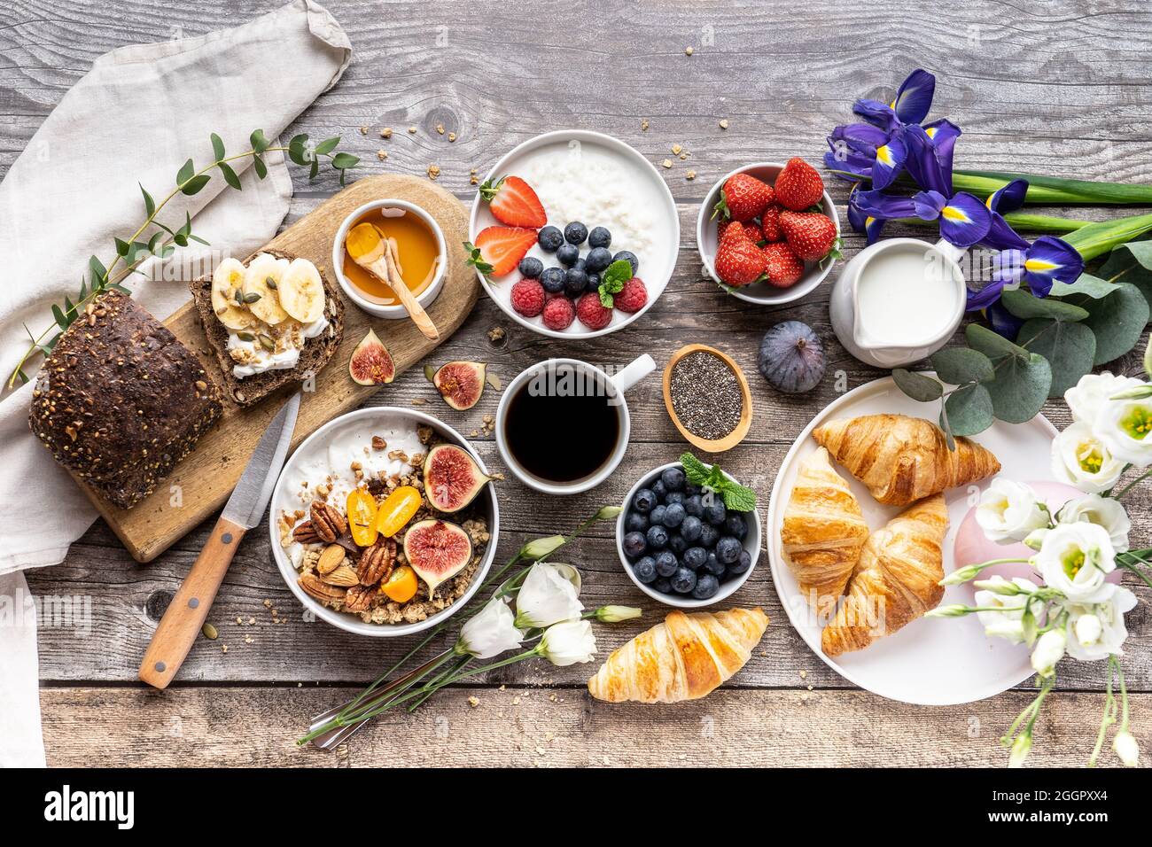 Beautifully served table for breakfast with many delicacies, cheeses ...