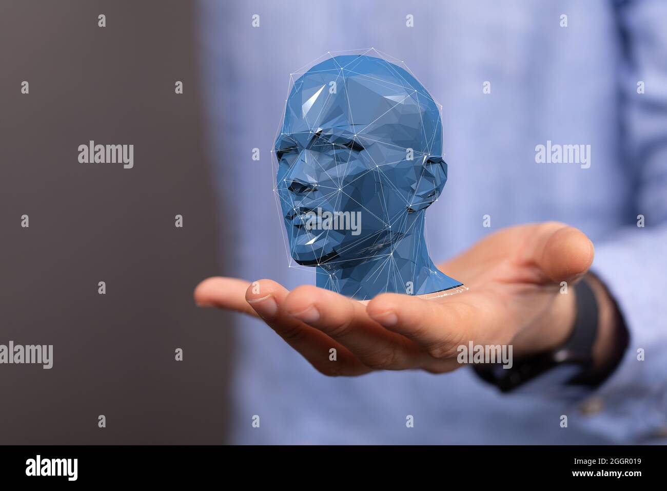 Person presenting a 3D render of a cyborg head construction ...