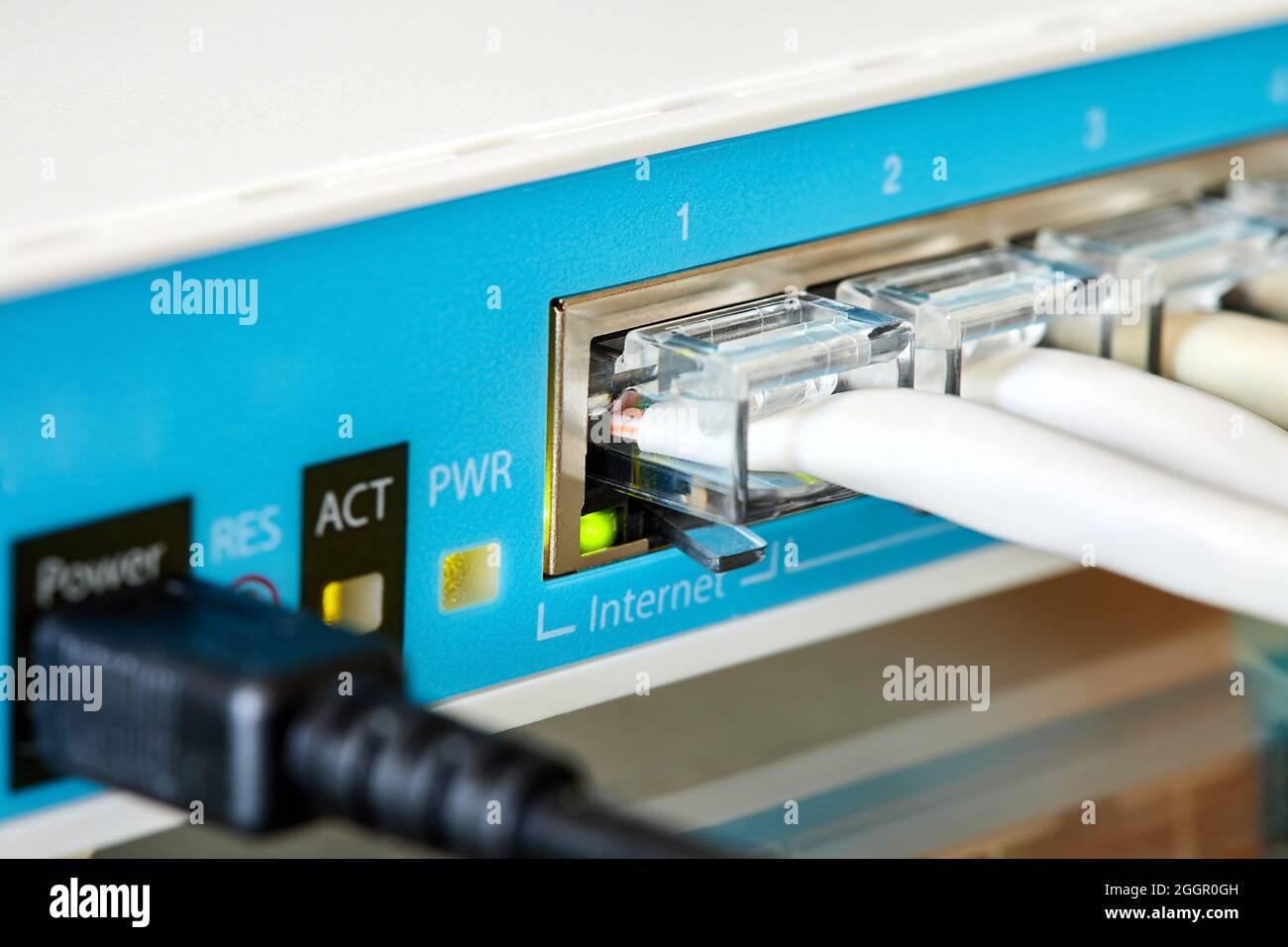 Ethernet cables connected to Desktop Switch or routerboard. Close-up ...
