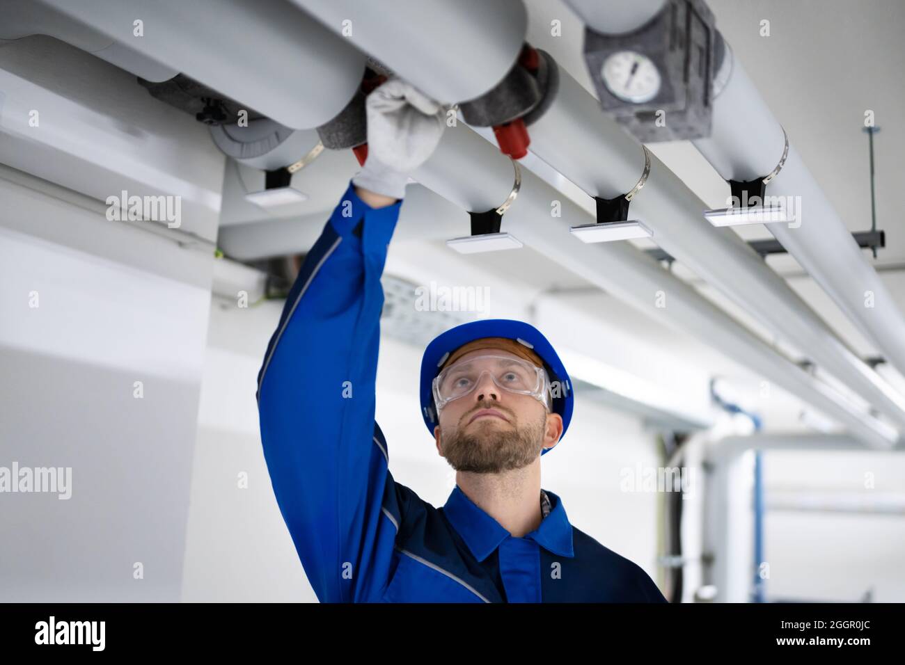 PVC Water Pipe Inspection By Construction Worker Stock Photo - Alamy