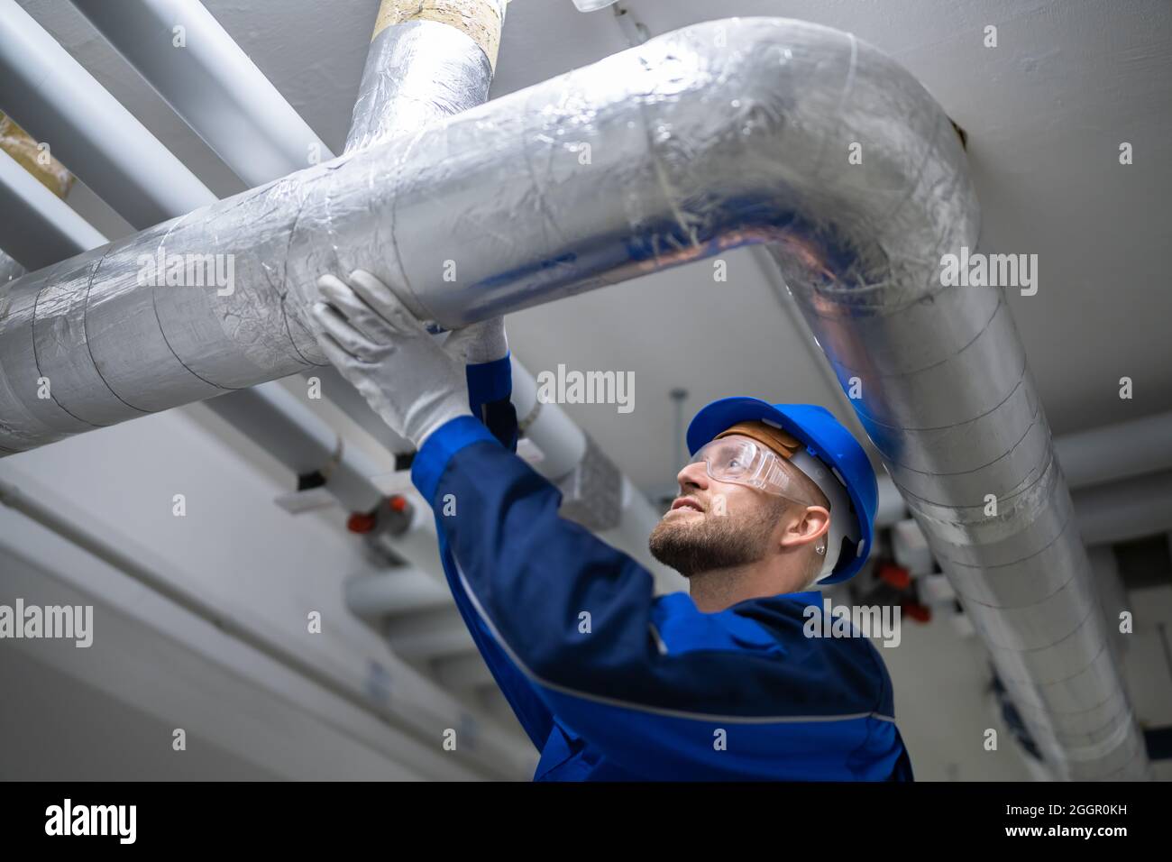 PVC Water Pipe Inspection By Construction Worker Stock Photo - Alamy