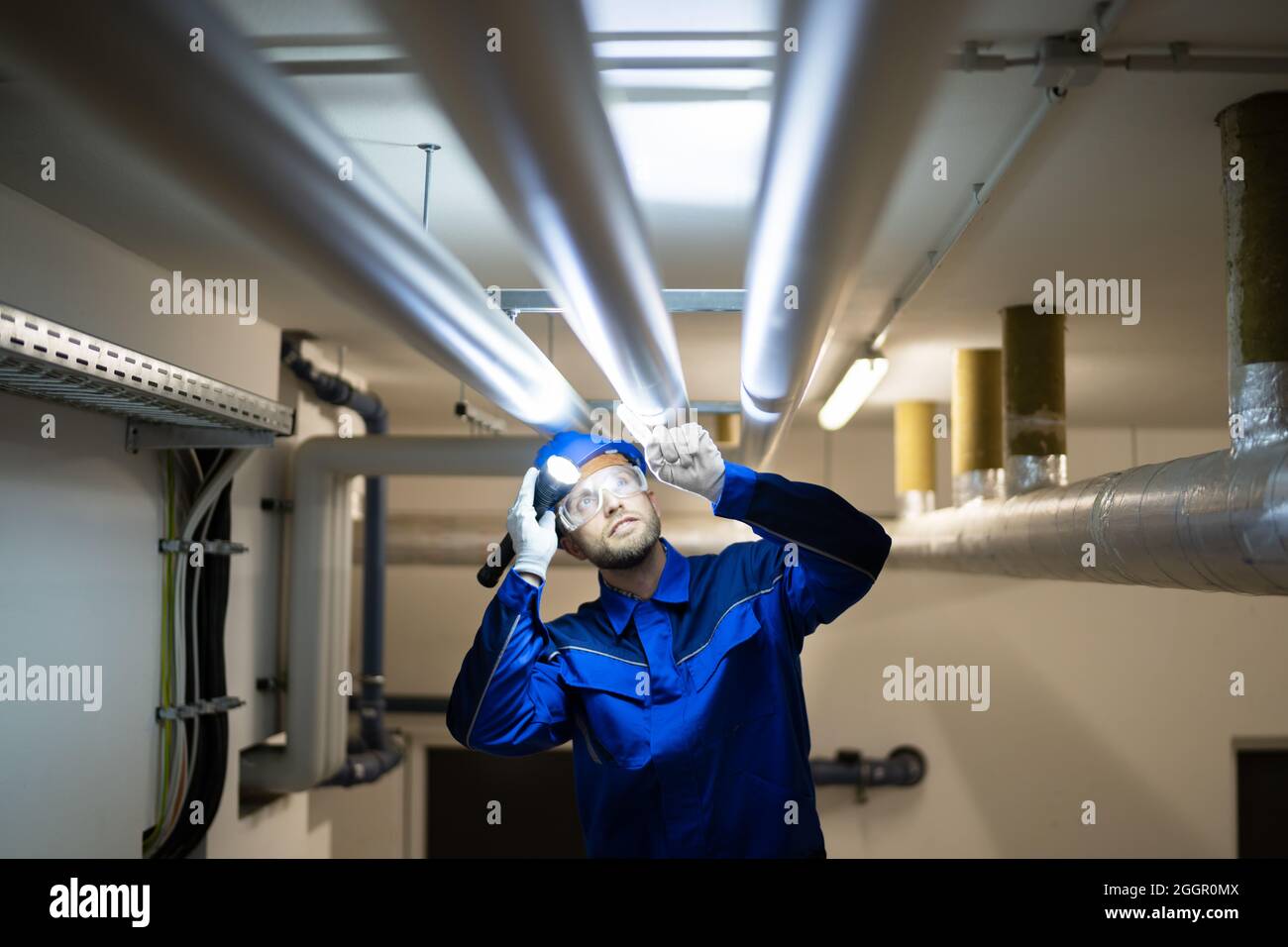 PVC Water Pipe Inspection By Construction Worker Stock Photo - Alamy