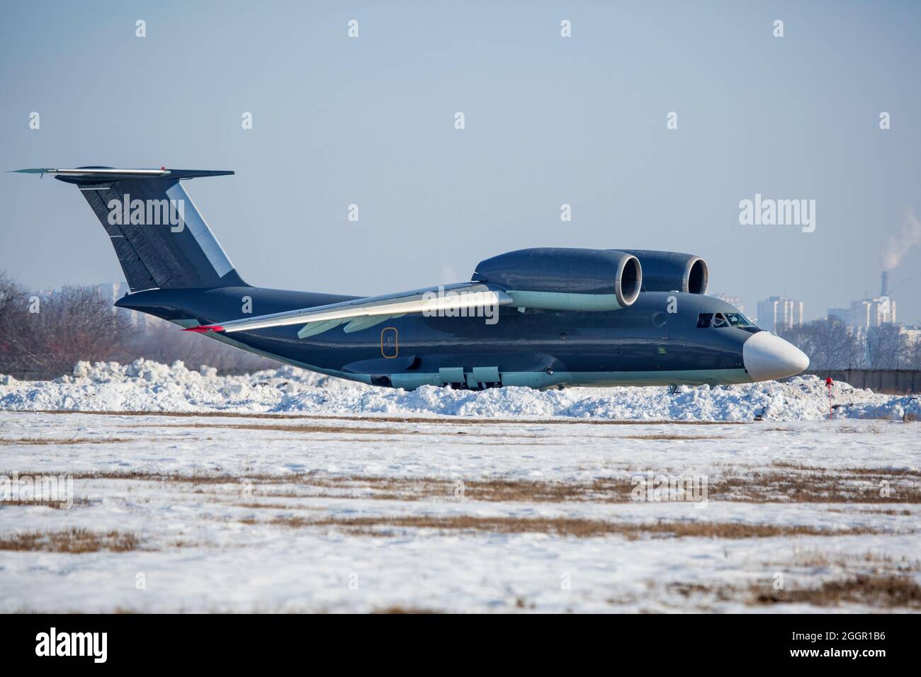 Cargo plane in the winter on the runway. Cargo plane at the airport ...