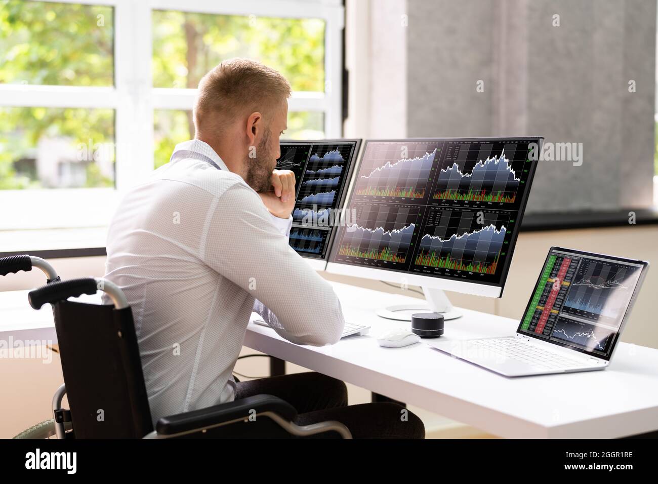 Stock Broker Or Trader In Office Using Multiple Computer Screens Stock ...