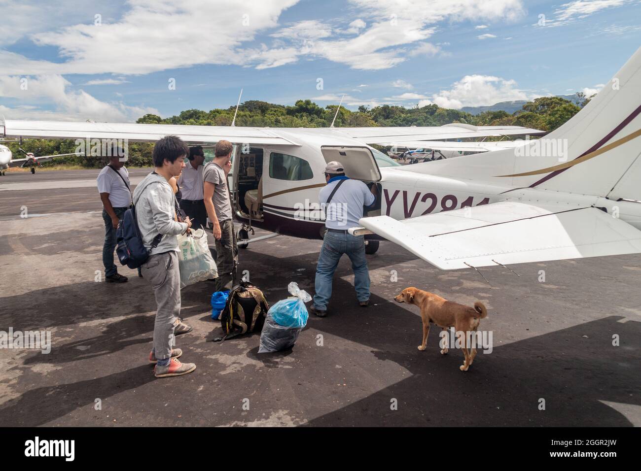CANAIMA, VENEZUELA - AUGUST 16, 2015: Passengers of Cessna 210 ...