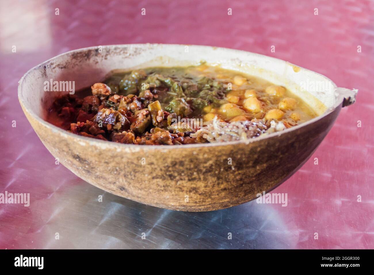 Meal consisting of beans, vegetables and achar, served in calabash ...