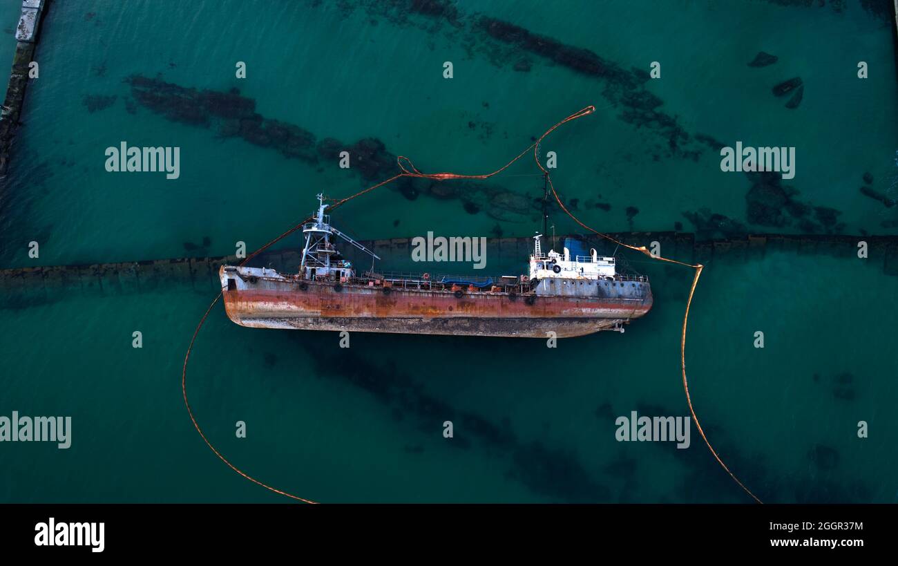 sunken tanker. Tanker Bunker threw storm ashore. The tanker lies on its ...
