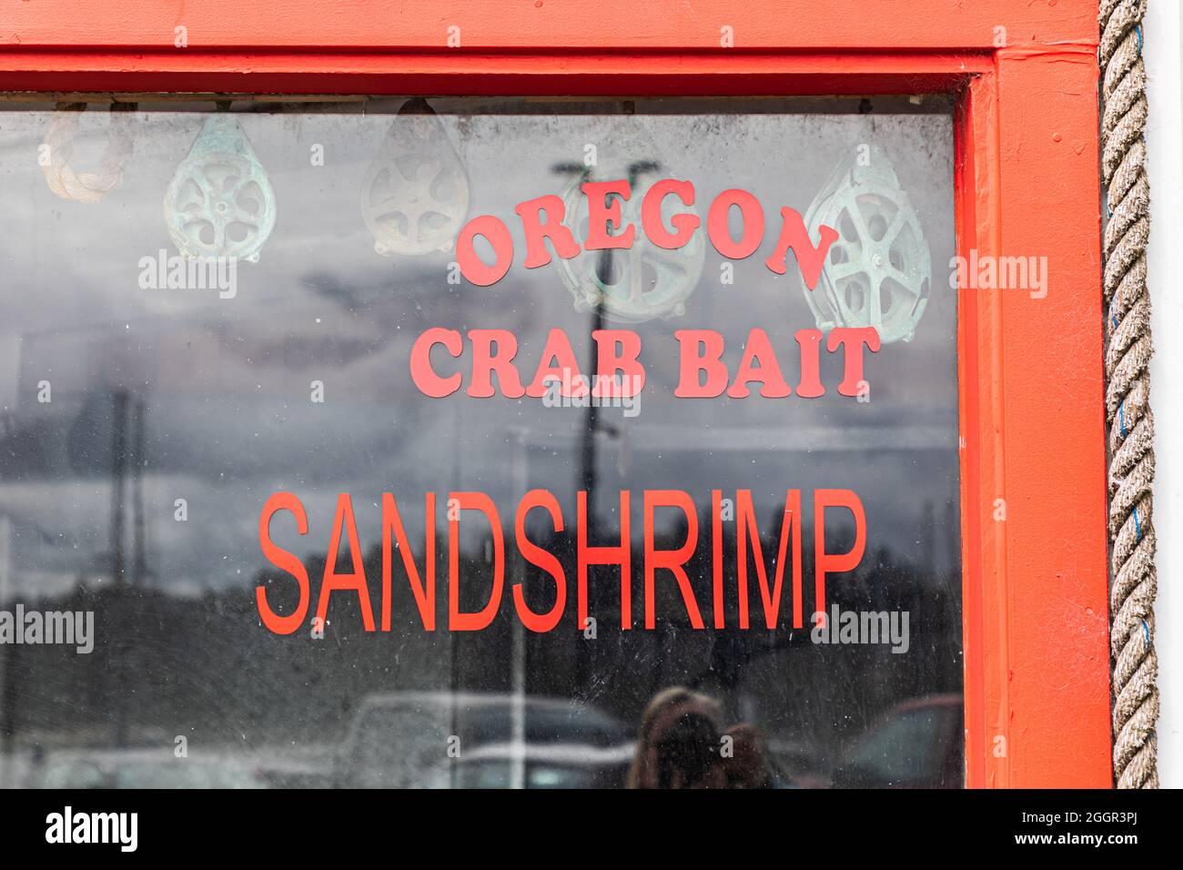 Coos Bay, Oregon, USA. May 2, 2021. Signs on a bait and tackle store on ...