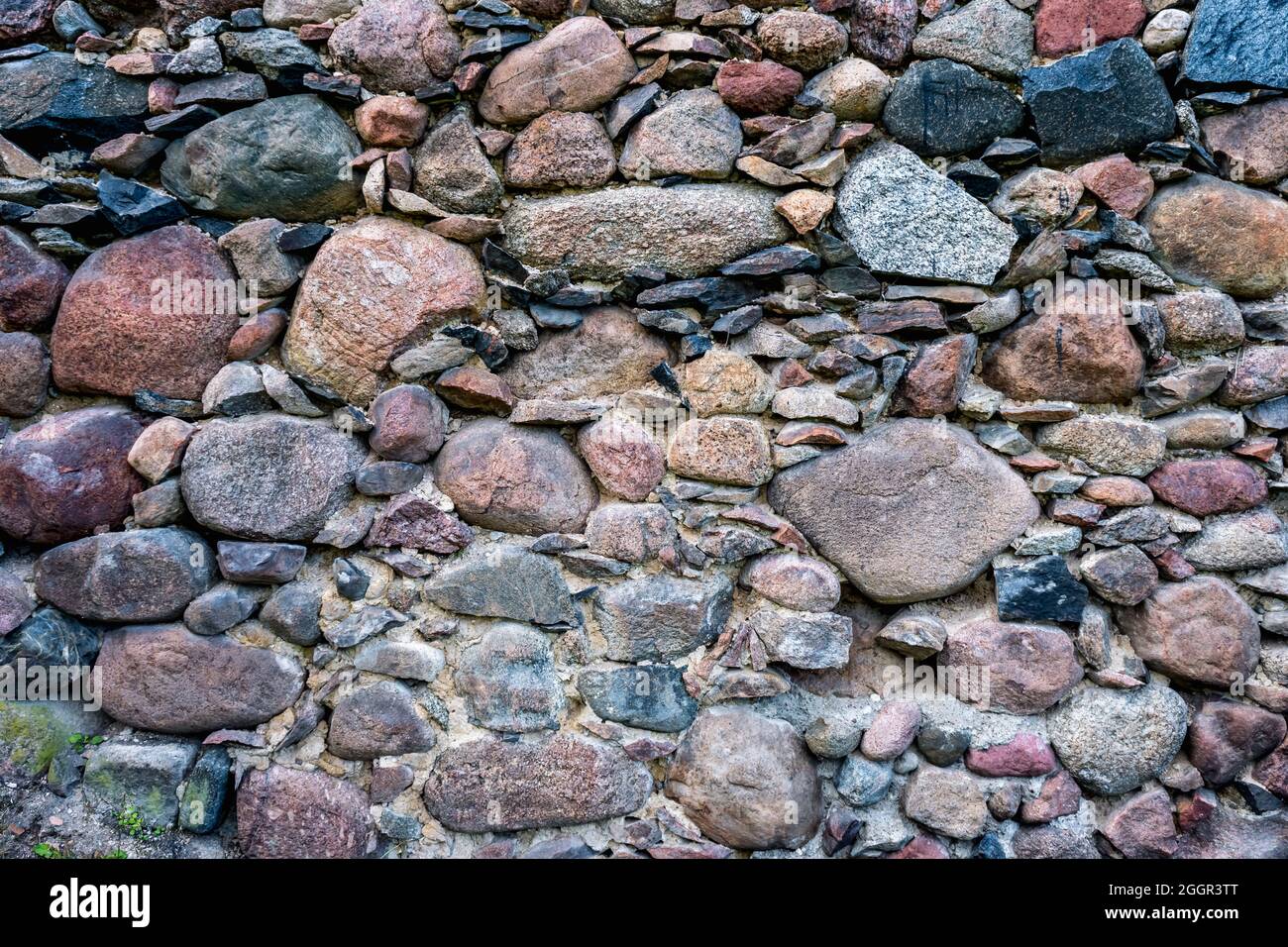 surface of old wall of huge stones of a destroyed ancient building ...