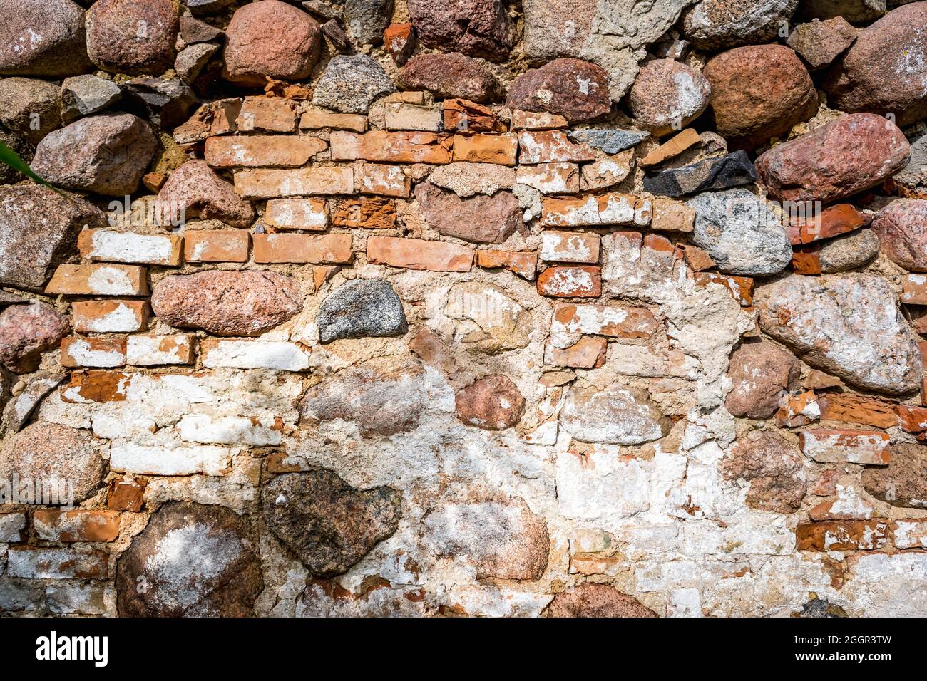 surface of old wall of huge stones of a destroyed ancient building ...