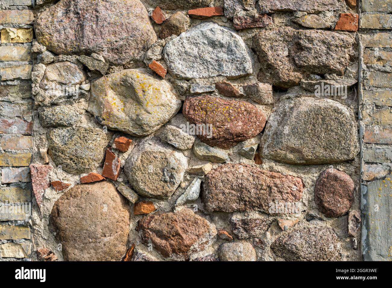 surface of old wall of huge stones of a destroyed ancient building ...