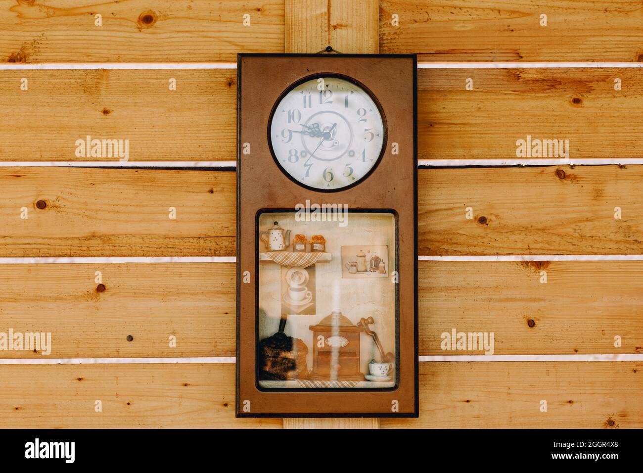 Creative antique wall clock hanging on wooden wall. Clock ornament for ...