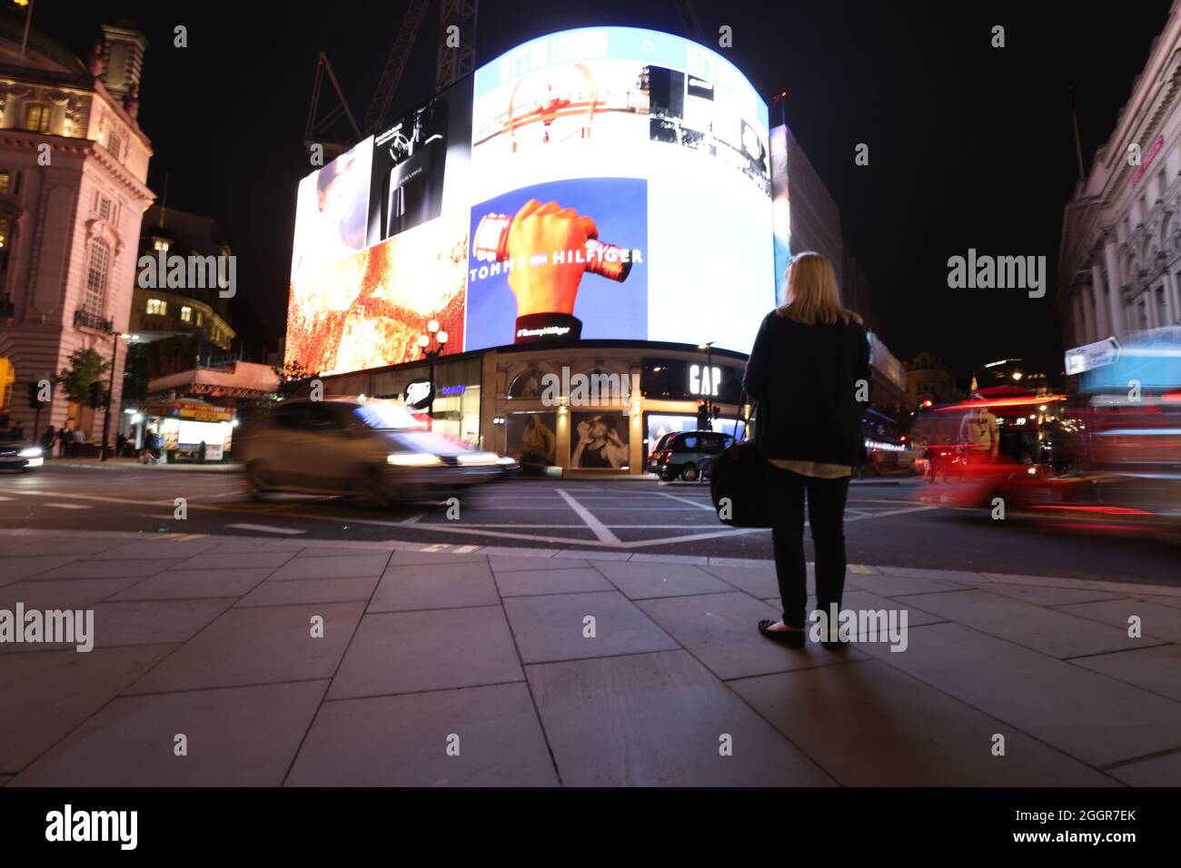 A lady stands in Piccadilly Circus in London. Picture date: Thursday ...
