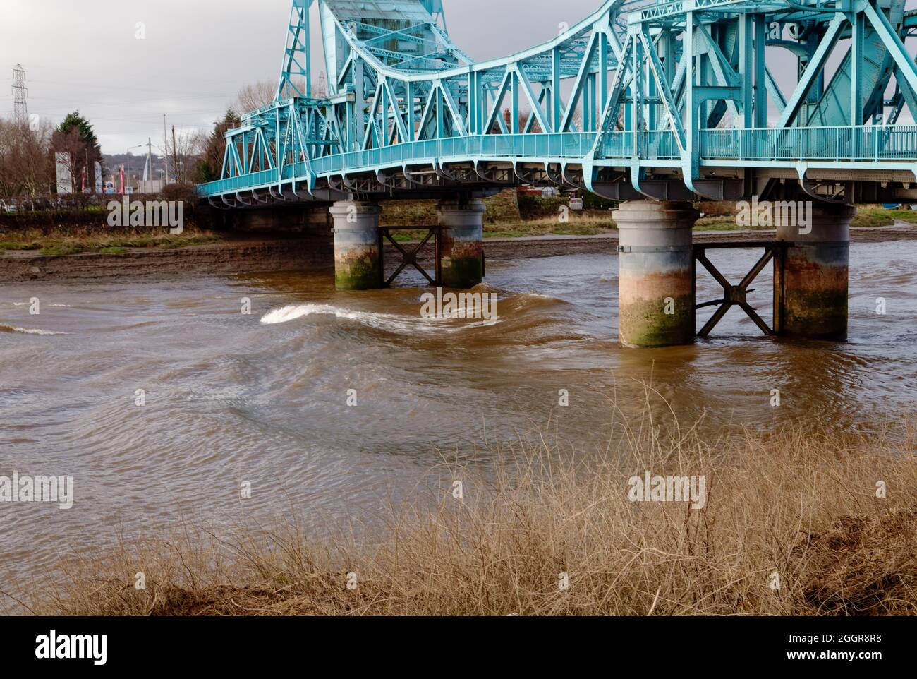The Dee Tidal Bore passing the Jubilee Bridge at Queensferry, also ...