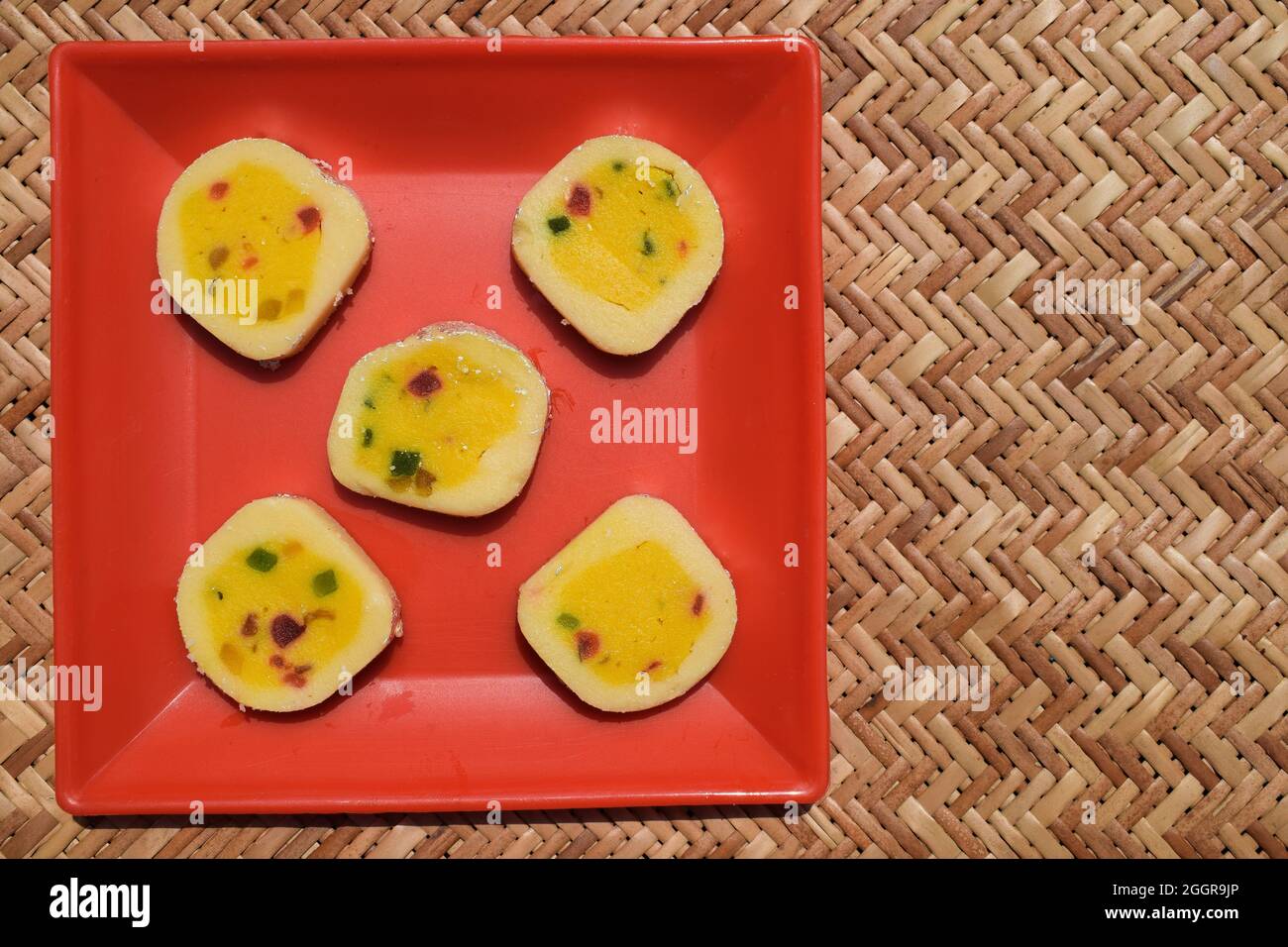 Indian sweet dish Tutti fruity Barfi rolls. With tutti frutti kesar ...