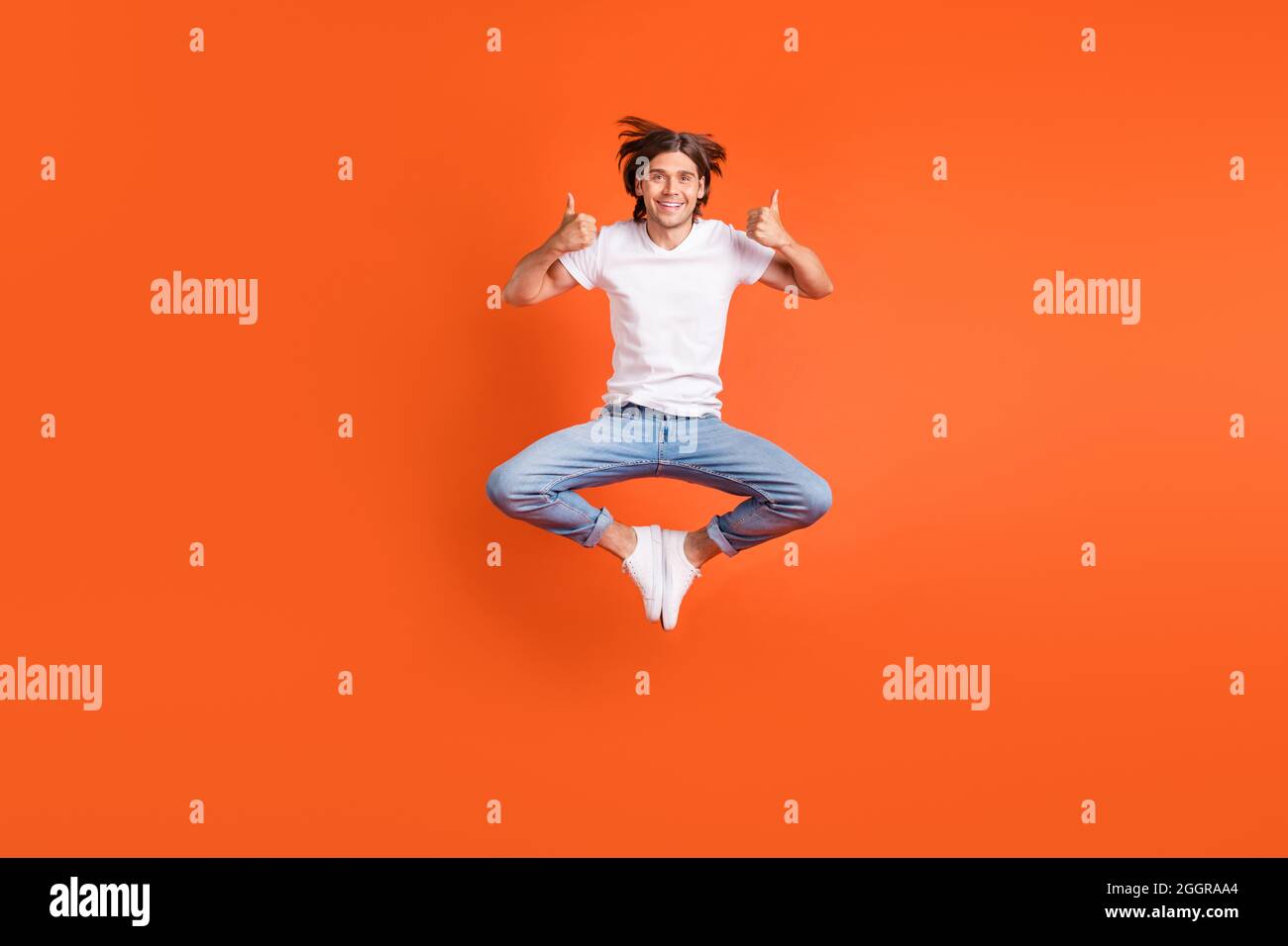 Full length photo of young funky happy man jump up good mood thumbs up ...
