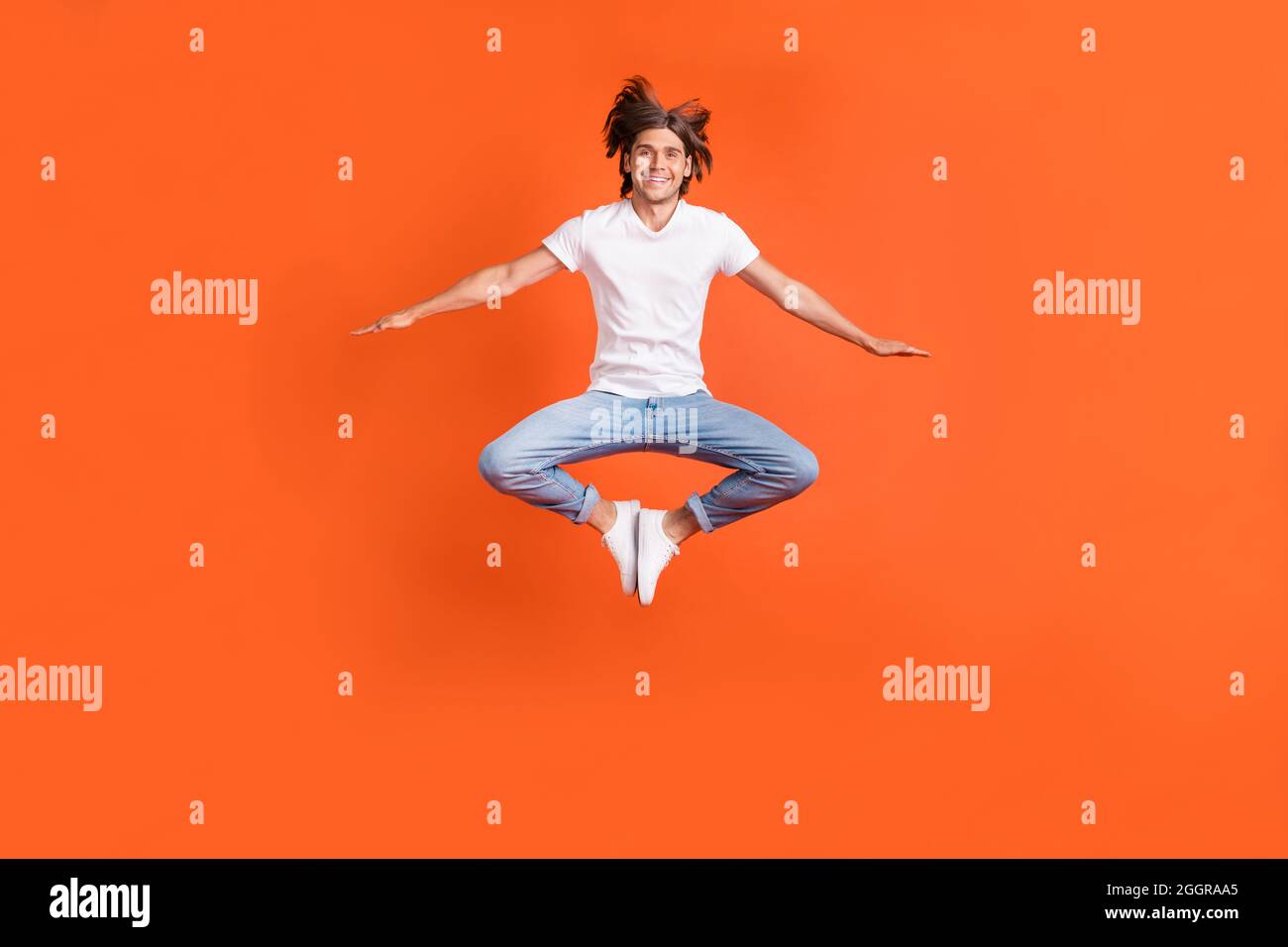 Full body photo of happy positive cheerful man jump up good mood active ...