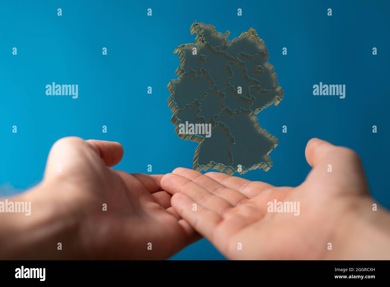 3D floating Germany map over a male's hands on a blue background Stock ...