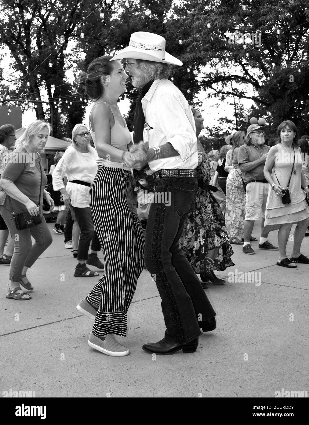Couples dance at an outdoor music concert in the historic Plaza in ...