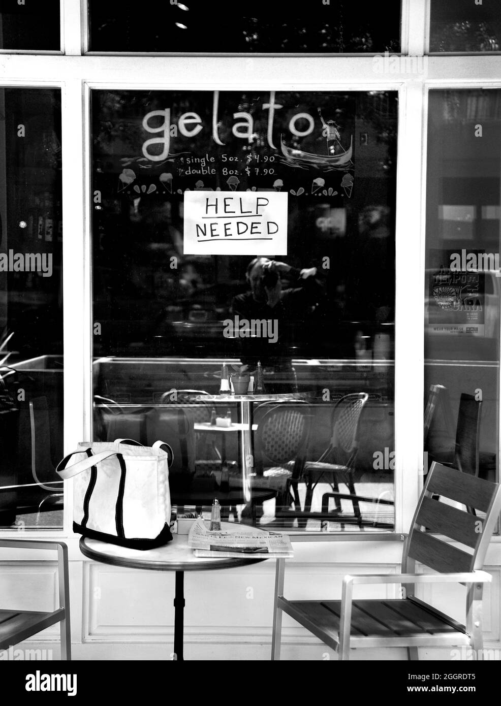 A "Help Wanted" sign in the window of a cafe in Santa Fe, New Mexico ...