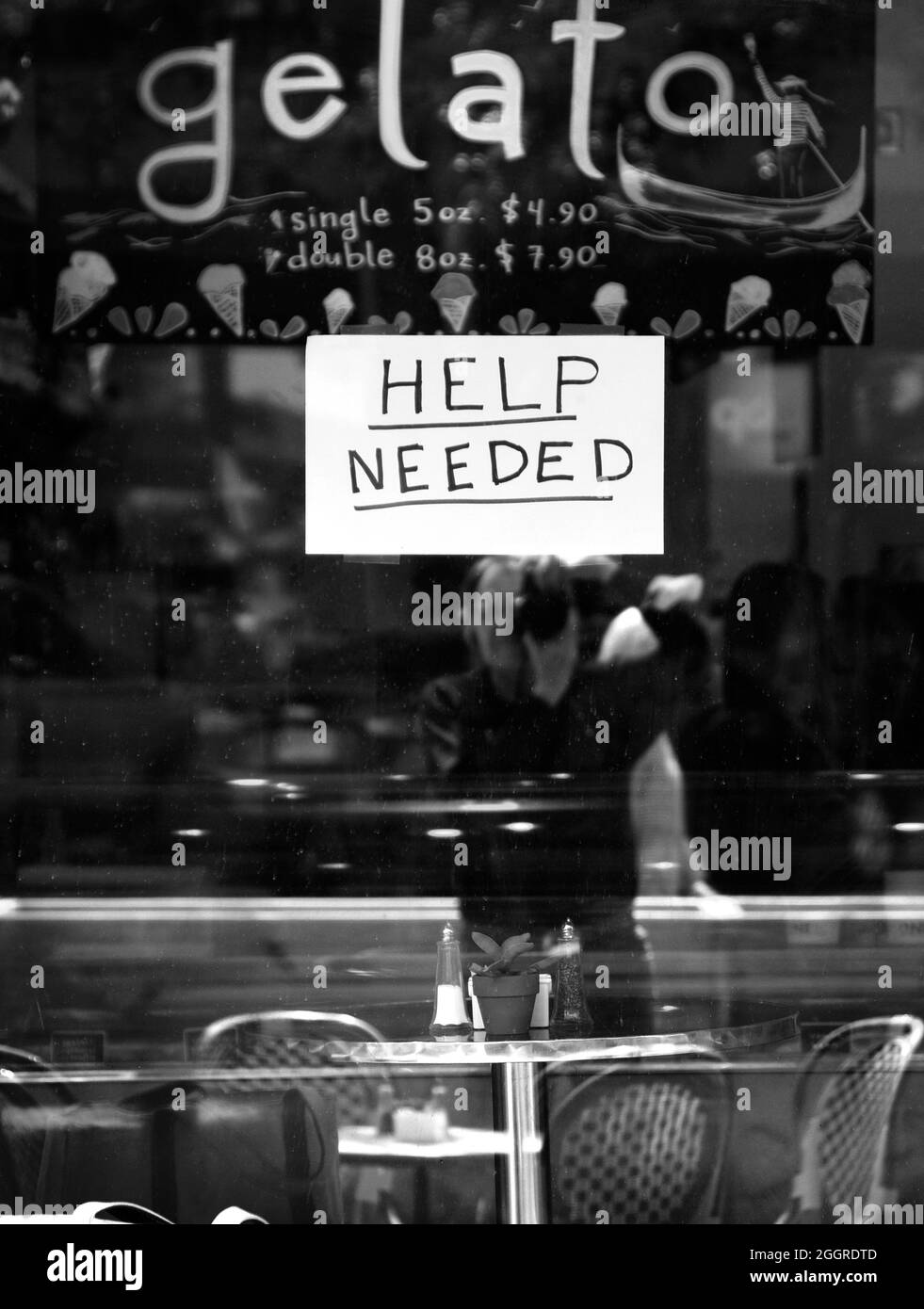 A "Help Wanted" sign in the window of a cafe in Santa Fe, New Mexico ...