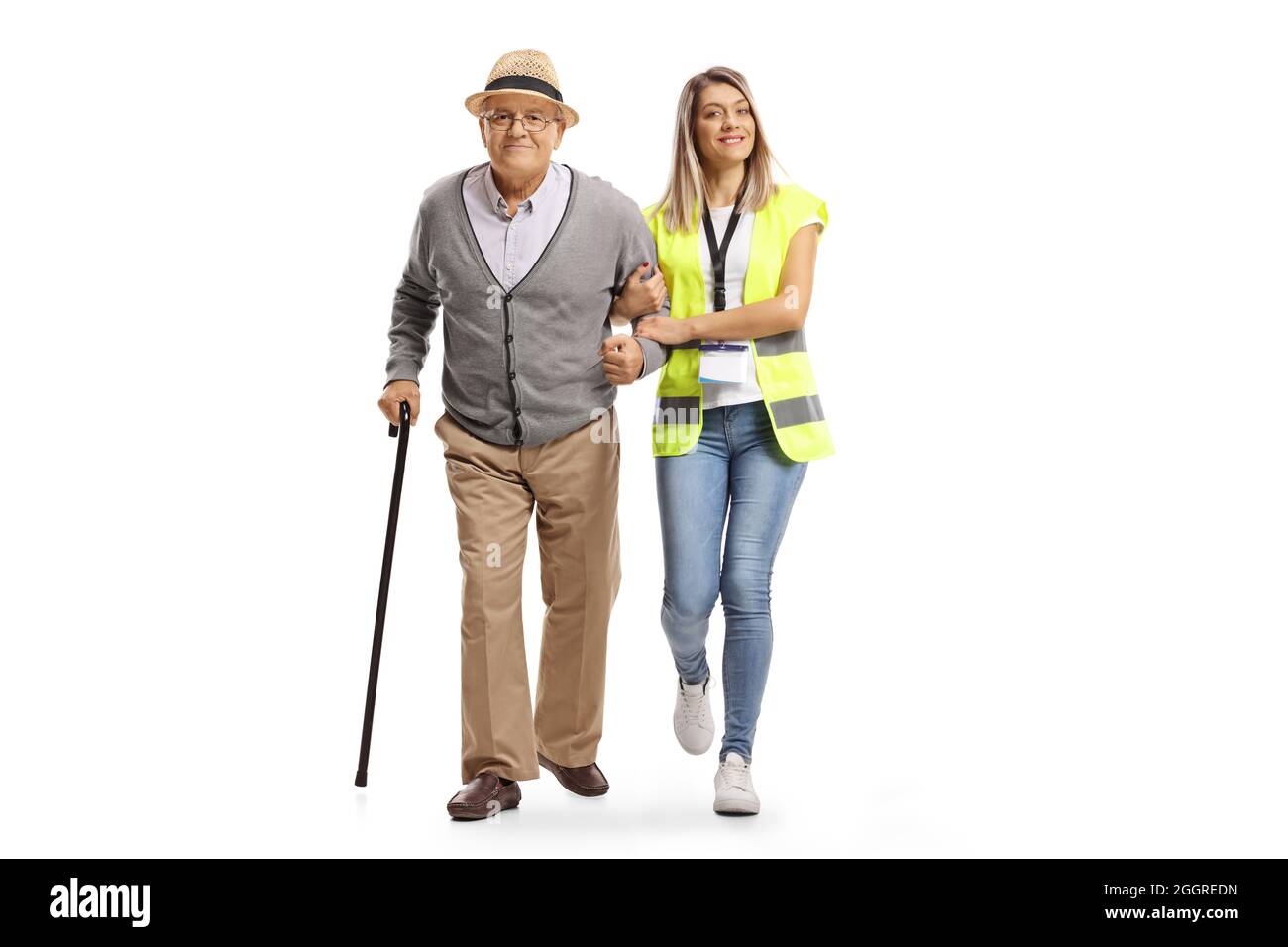 Full length portrait of a female community worker helping an elderly ...