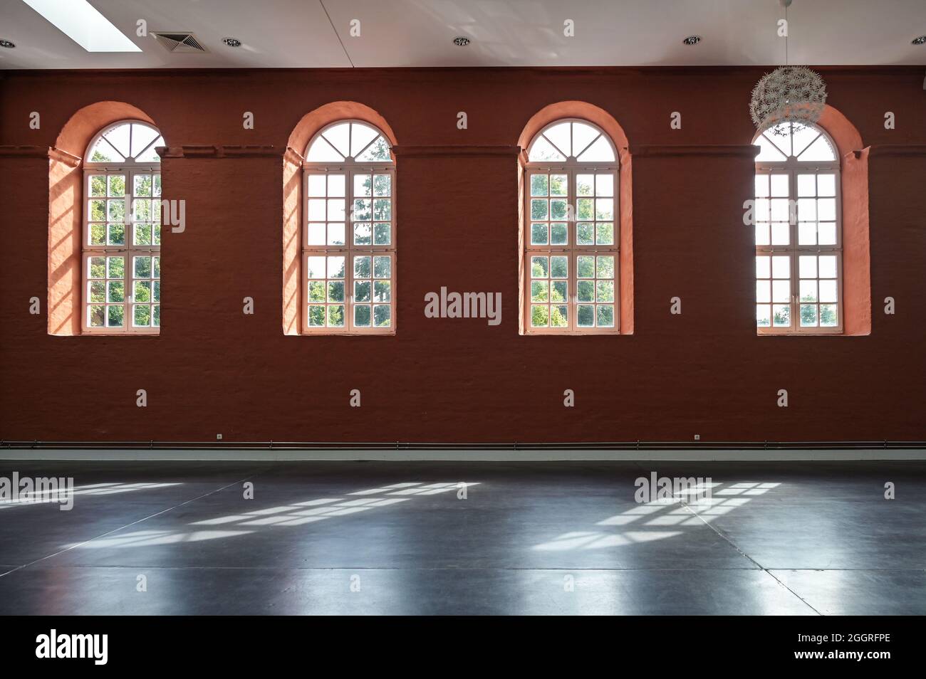 Putbus, Germany, August 22, 2021: red wall with arched windows in the ...