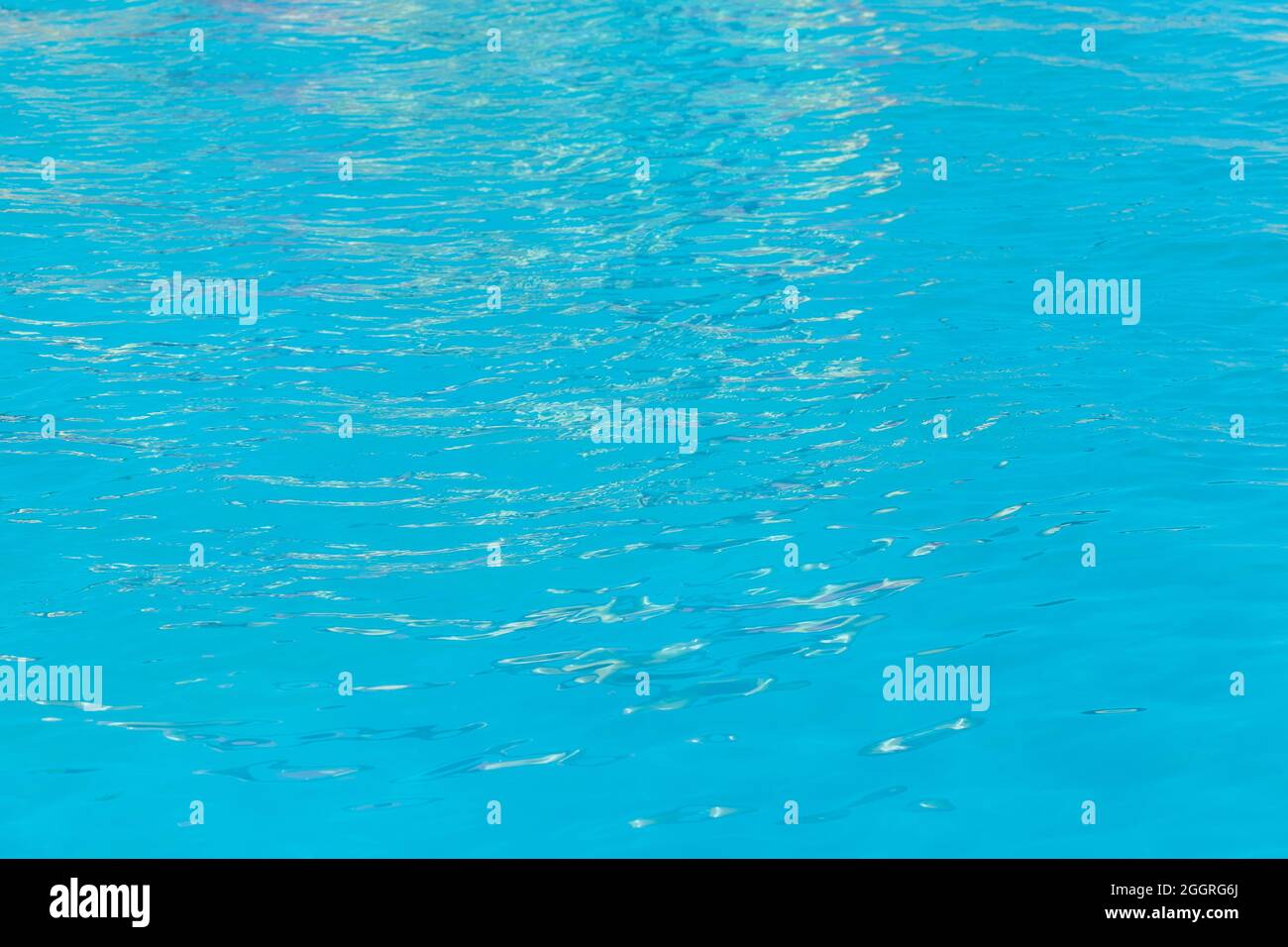 Blue clear pool water with abstract pattern of reflection and wave ...