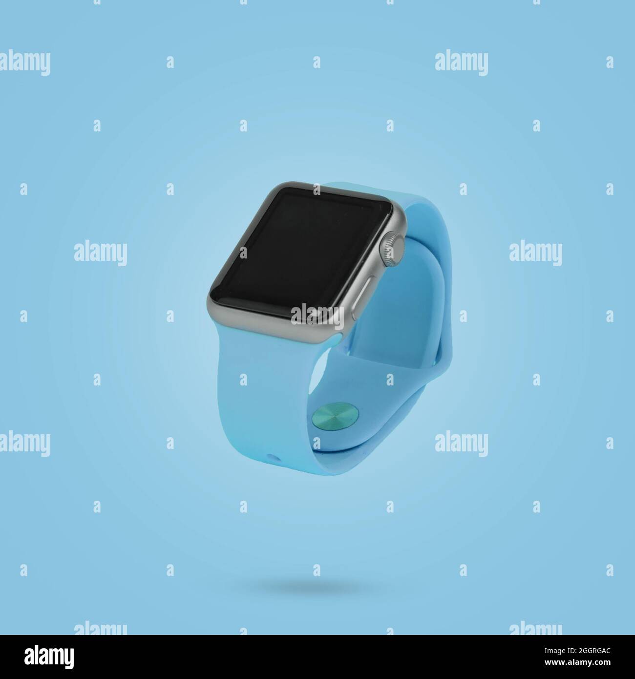 Smart watch floating in air on blue background on pastel blue ...