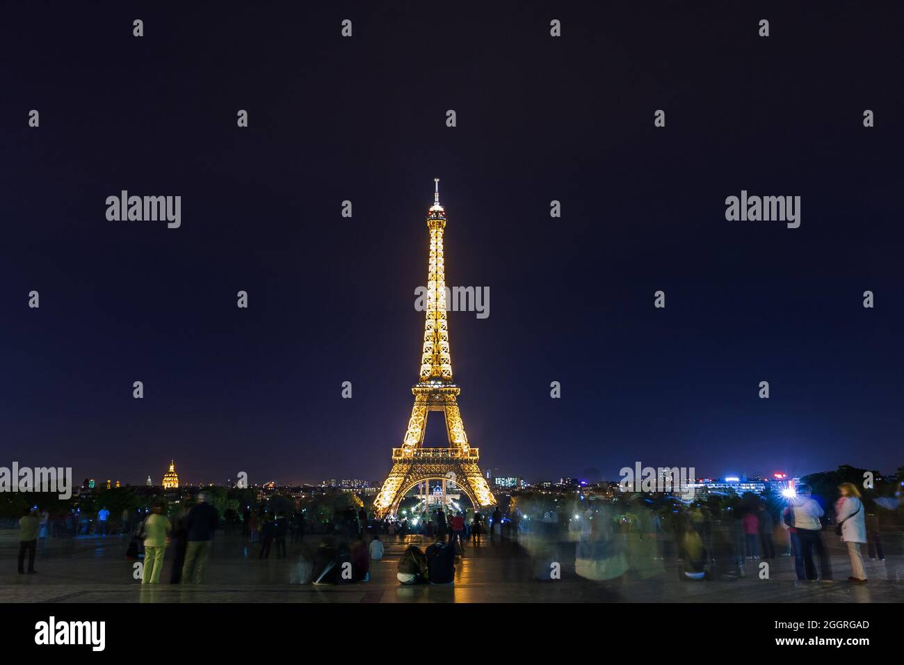 Eiffel Tower illuminated at night. Eiffel Tower is one of the most iconic landmarks in Paris ...