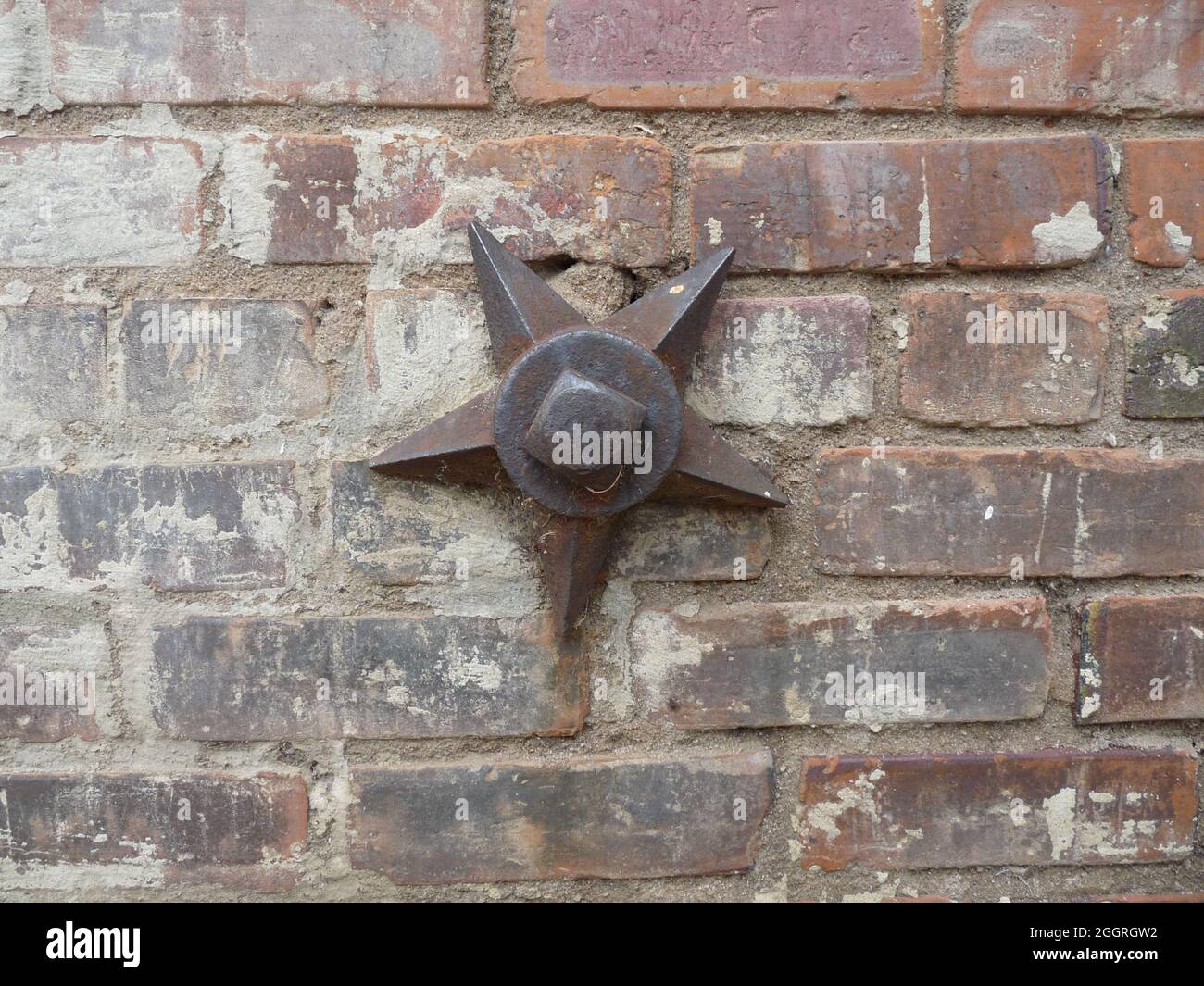Star bolt on old bricks Stock Photo - Alamy