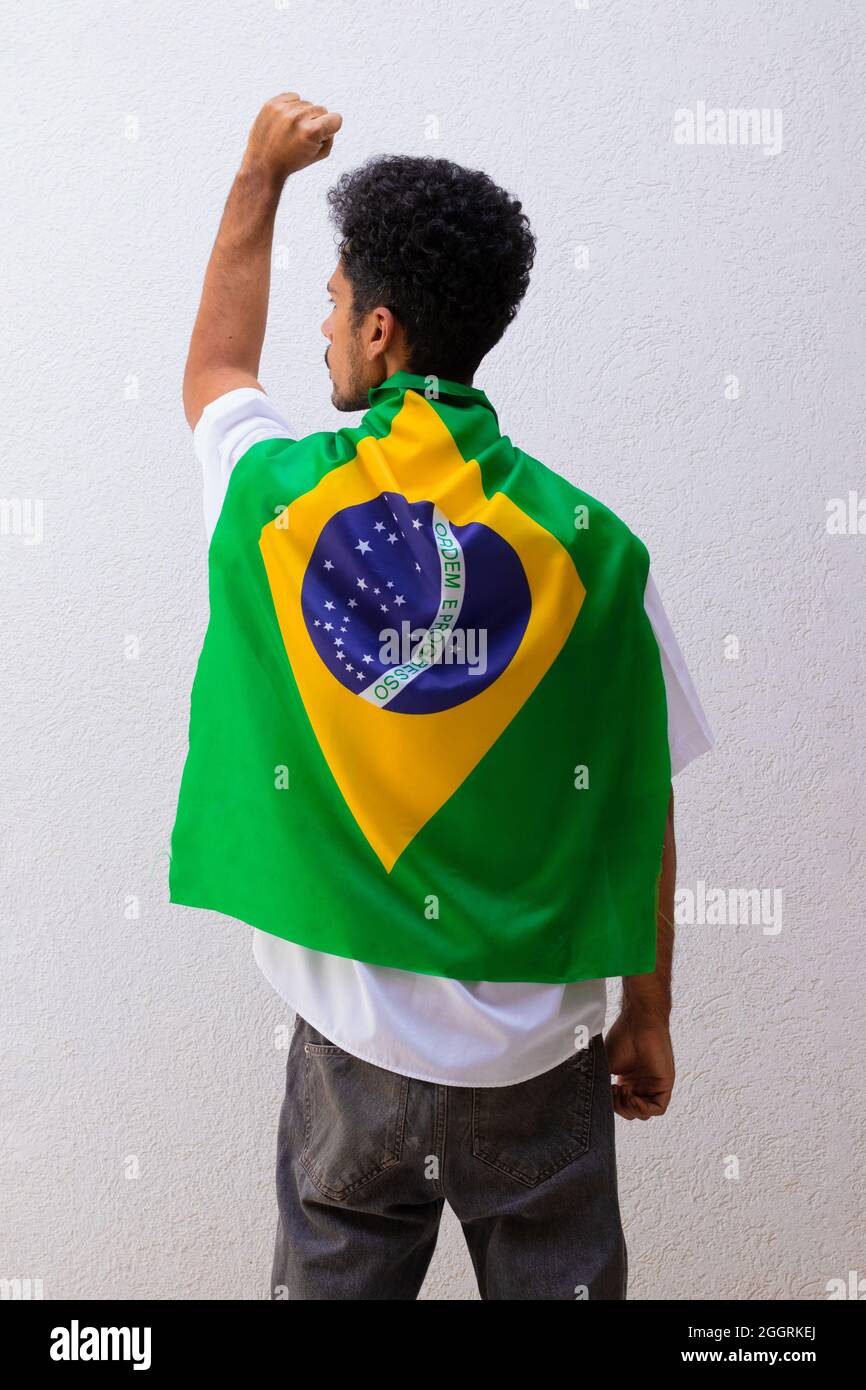 Back of a man with Brazilian flag hero cape isolated on white Stock ...