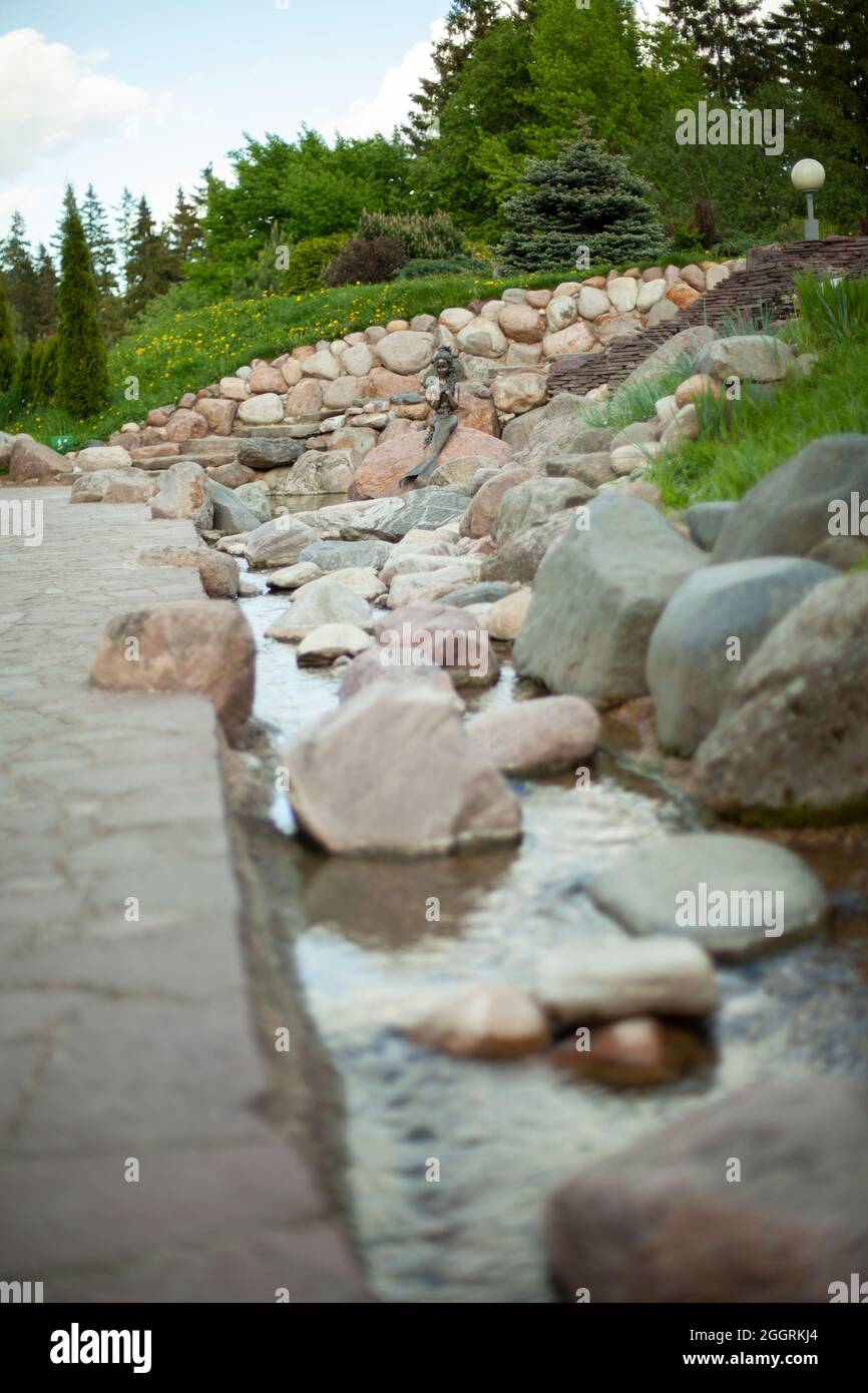 Park with stones. Resting place in summer. Landscaping Stock Photo - Alamy