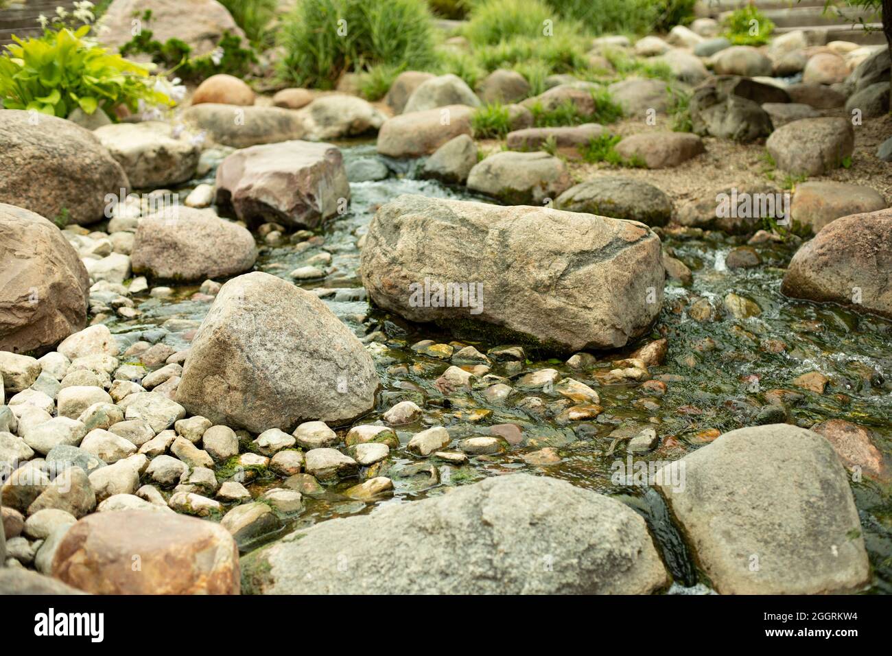 Stones in the landscape design of the park. Cobblestones in a mountain ...