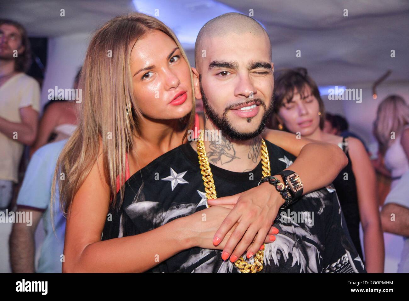 Girl kissing girl in night club hi-res stock photography and images - Alamy