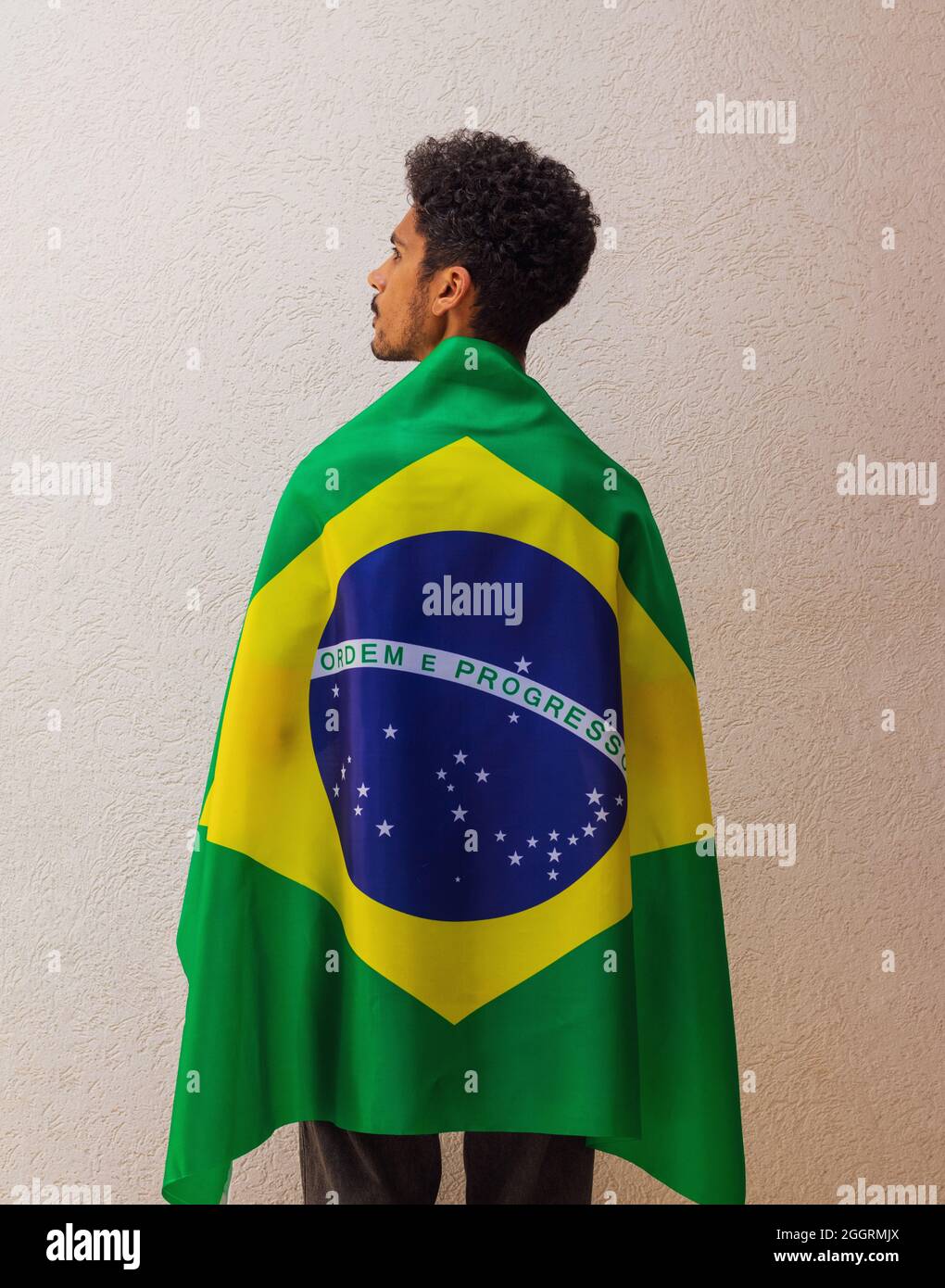 Back of a man with Brazilian flag hero cape isolated on white Stock ...