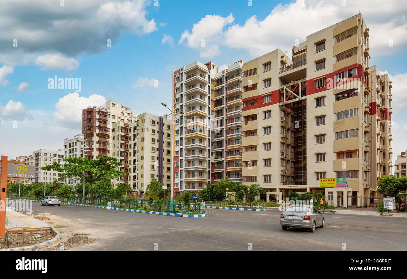 Commercial and residential apartment buildings with vehicles on city ...